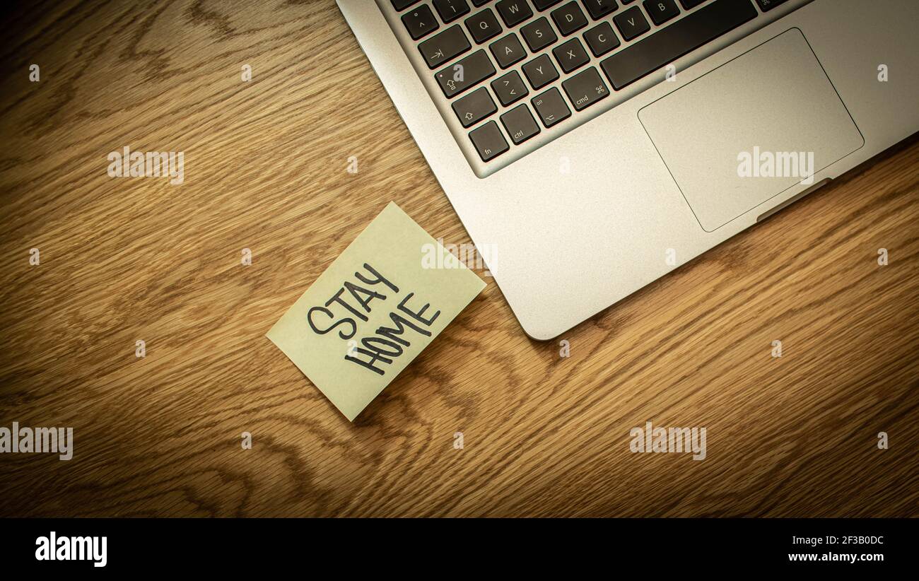 home office work note on wood table with laptop Stock Photo - Alamy