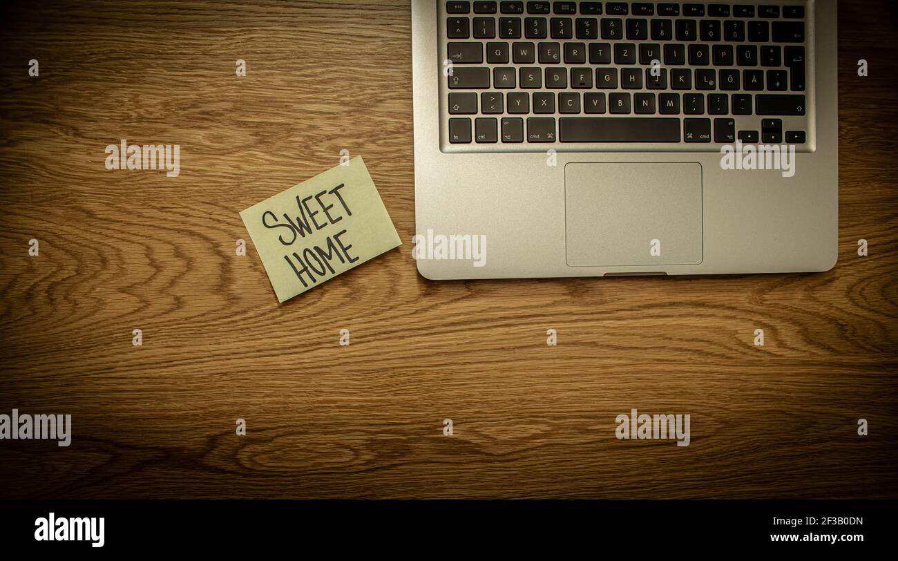 home office work note on wood table with laptop Stock Photo - Alamy
