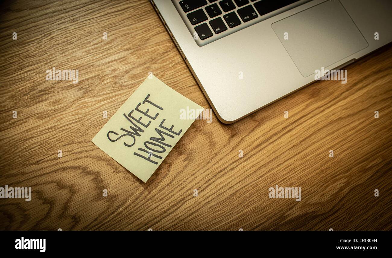 home office work note on wood table with laptop Stock Photo - Alamy