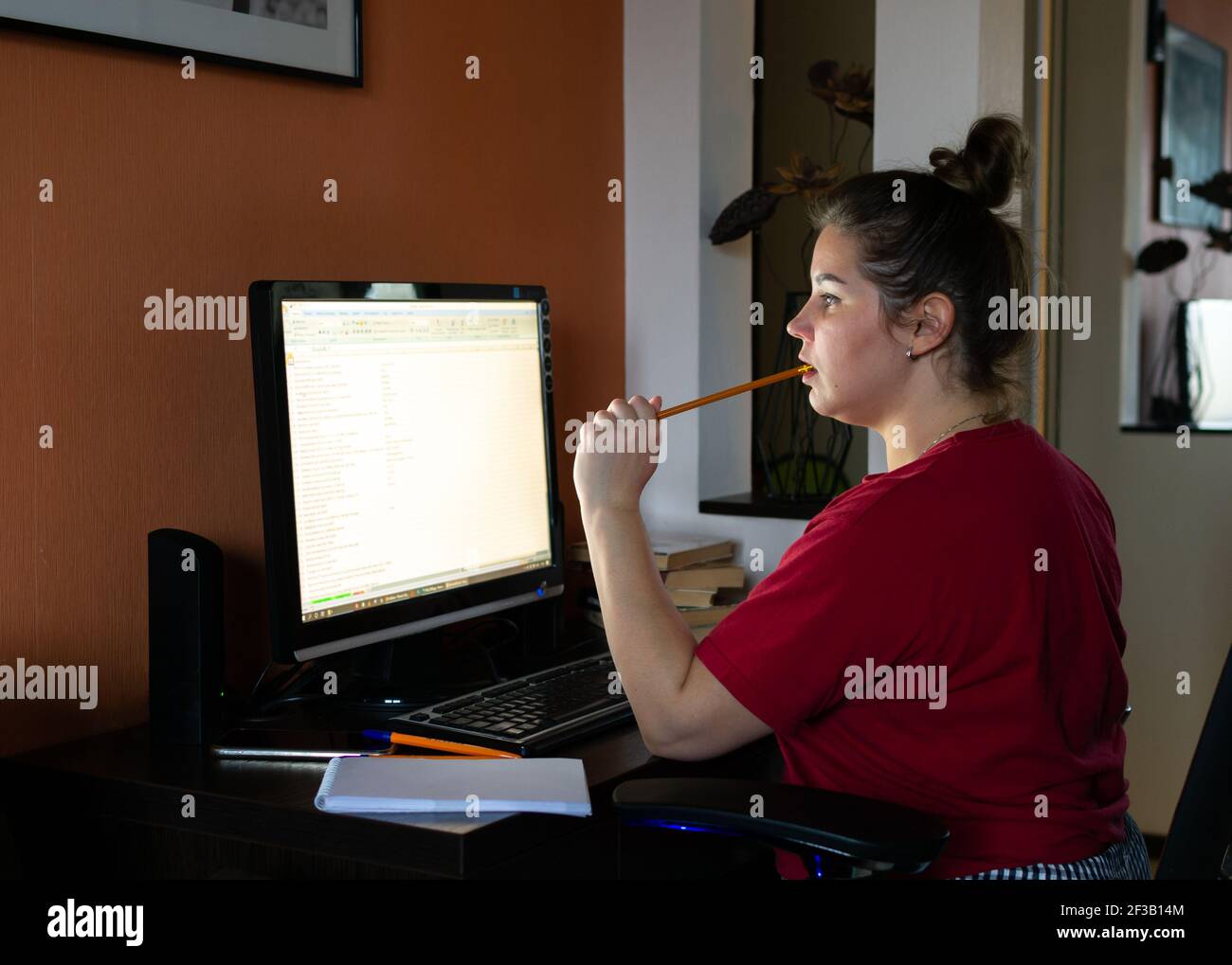 Young woman works on the computer hi-res stock photography and images ...