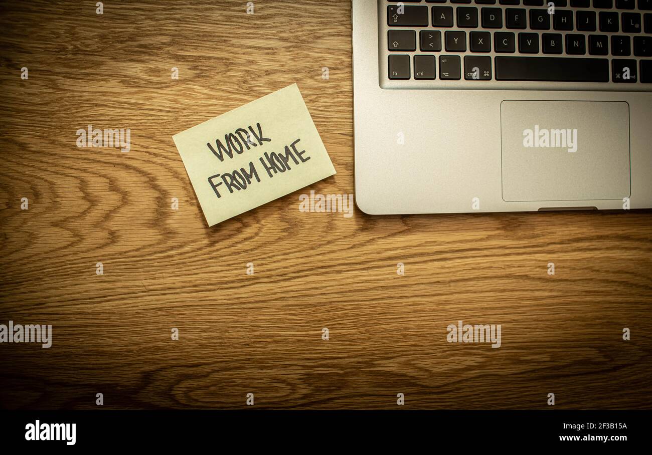 home office work note on wood table with laptop Stock Photo - Alamy