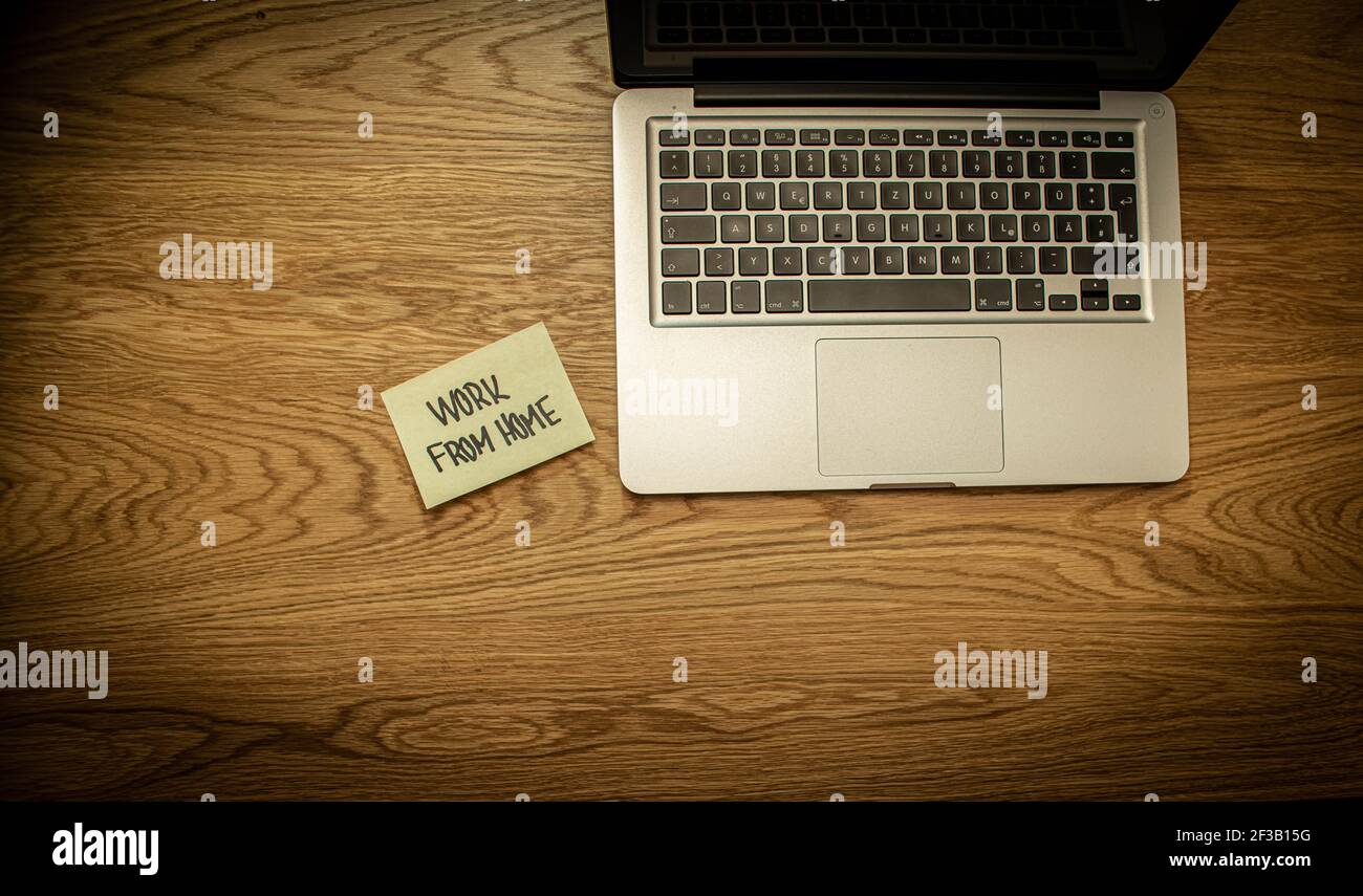 home office work note on wood table with laptop Stock Photo - Alamy