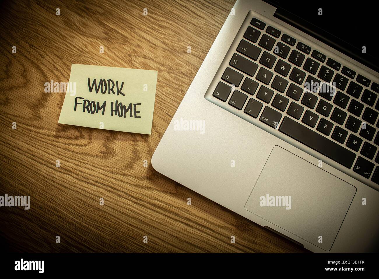home office work note on wood table with laptop Stock Photo - Alamy