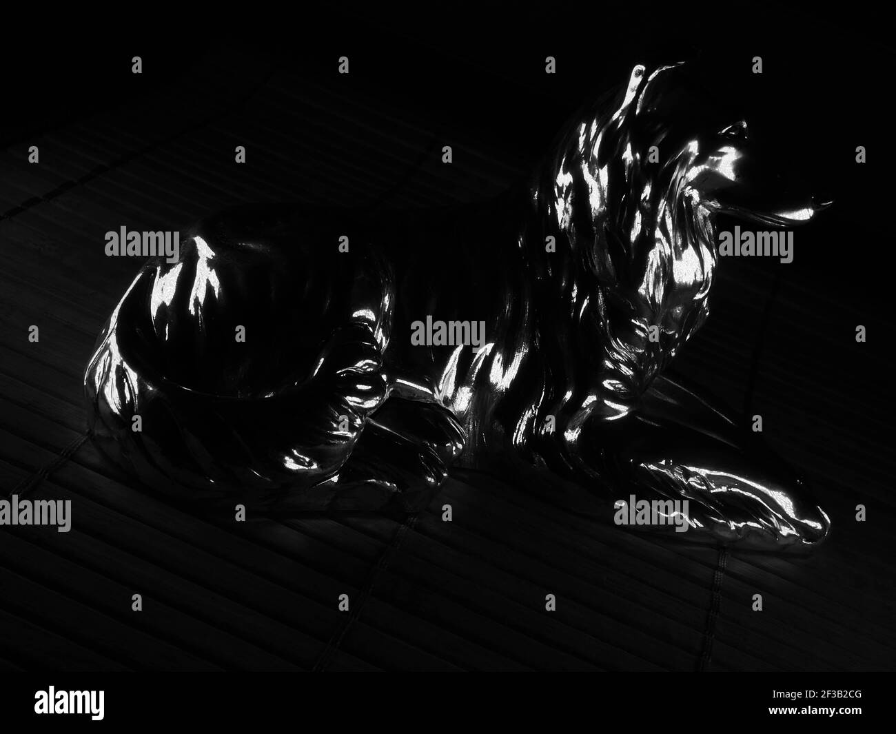 Bronze statue of a wolf howling at the stand side view isolated on ...