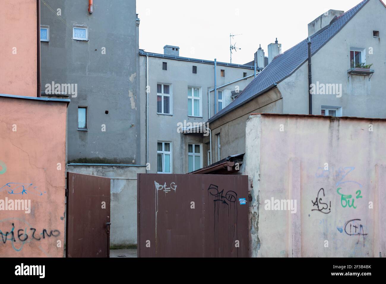 The squalid, seedy buildings of the poor district in Gniezno, Poland ...