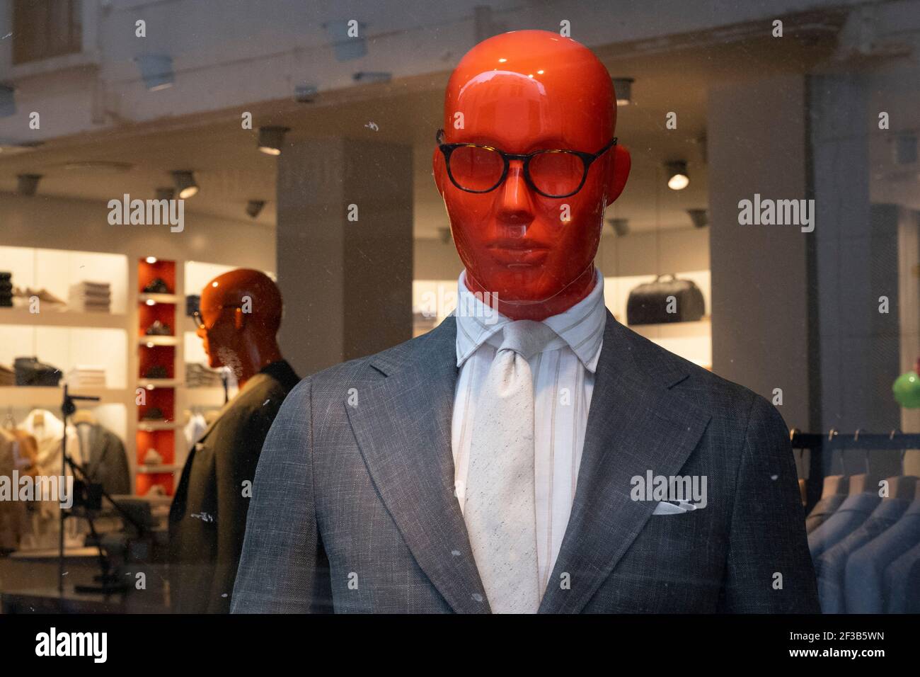 Red head mannequins in the shop window of Suitsupply suit shop on 5th ...