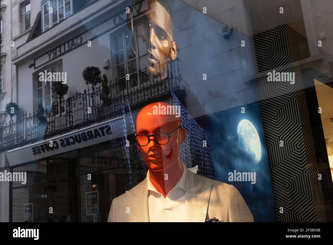 Red head mannequins in the shop window of Suitsupply suit shop on 5th ...