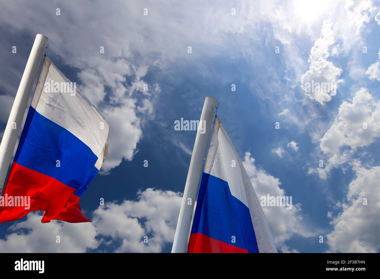 Russia flag waving in the wind against the sky. Three colors of Russian ...
