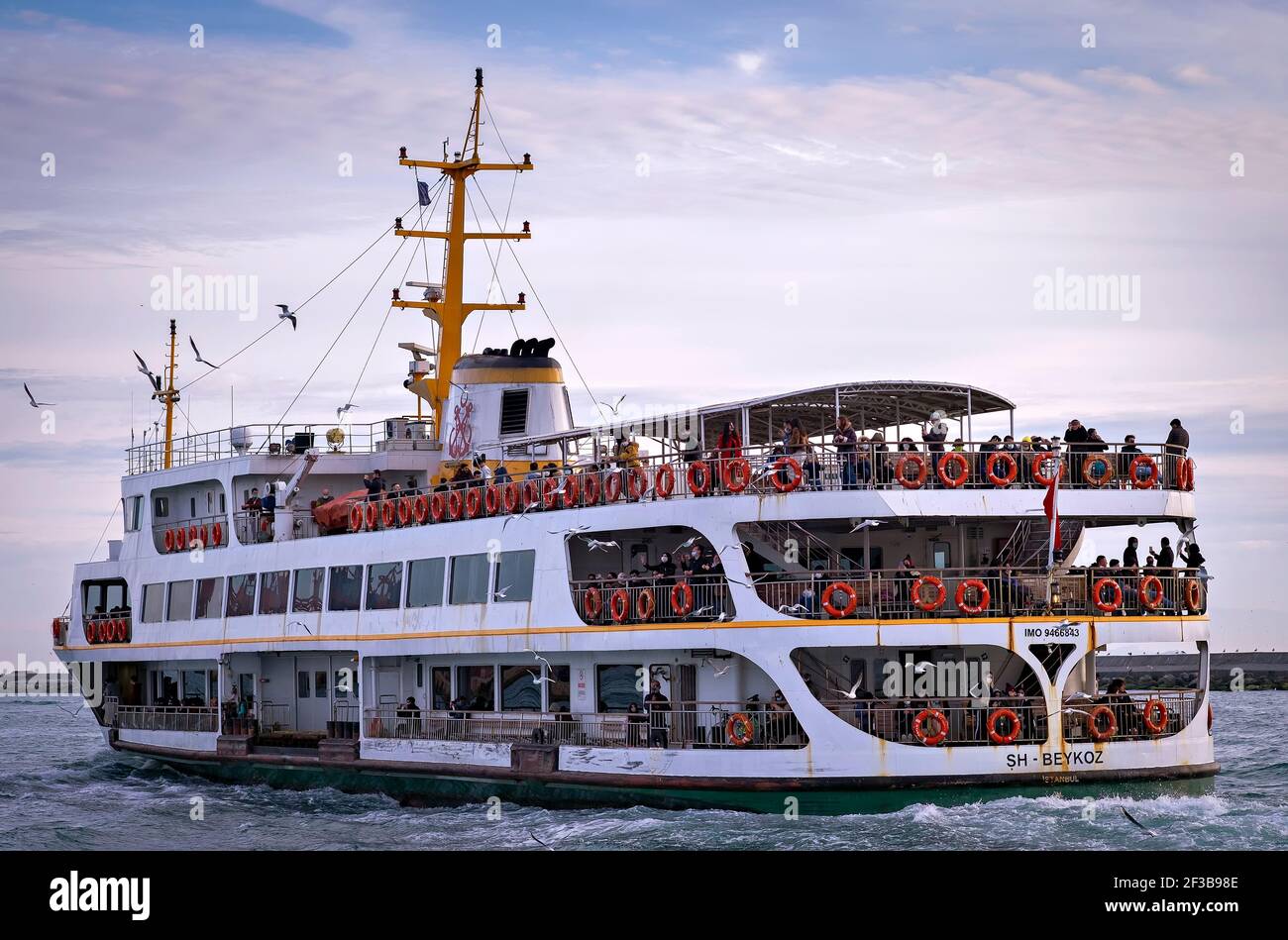 People are getting on the ferry boat in Besiktas. Every day nearly ...