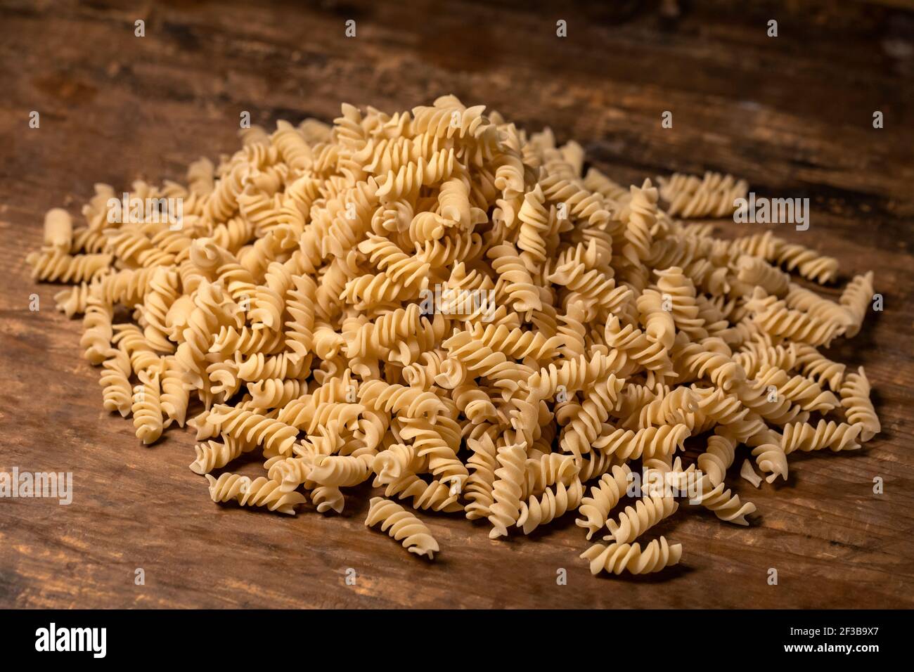 composition of uncooked fusilli italian pasta Stock Photo - Alamy