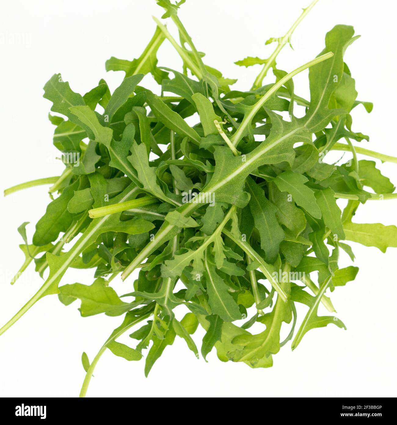 Pile of fresh arugula green leaves, close up. Isolated on white ...