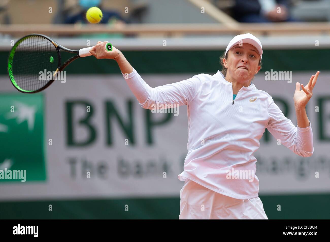 Polish tennis player Iga Swiatek playing a forehand shot during French ...