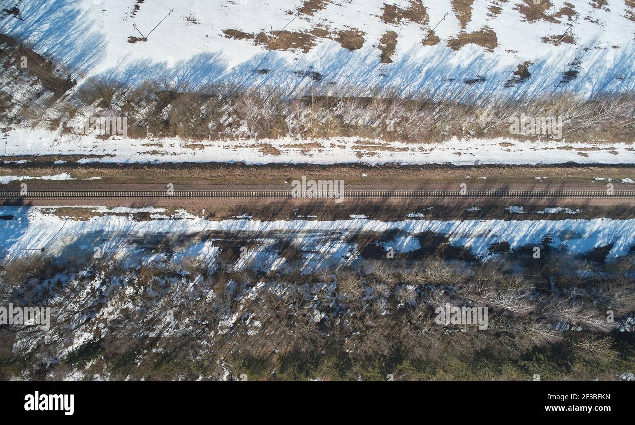 Empty railroad line above drone view on winter snow spot landscape ...