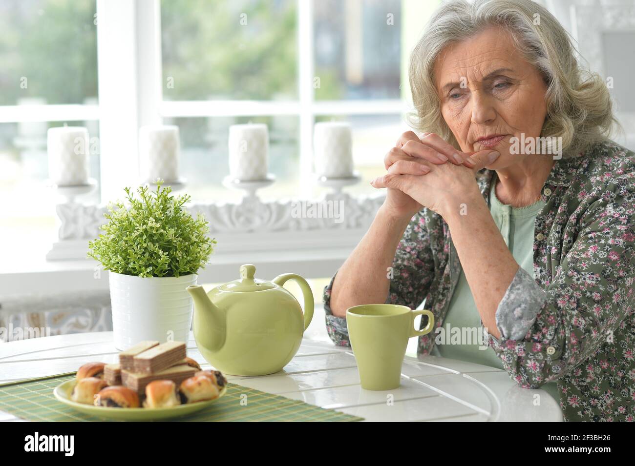 Sad adult woman drinking tea hi-res stock photography and images - Alamy