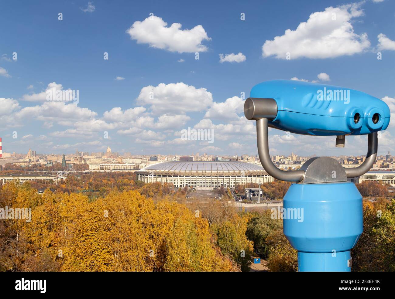 Touristic telescope viewer (binoculars) and view of central Moscow from ...
