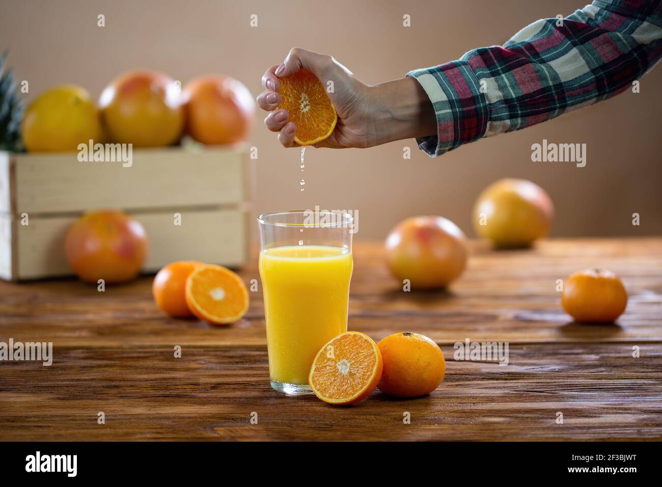Female hand squeezing orange juice hi-res stock photography and images ...