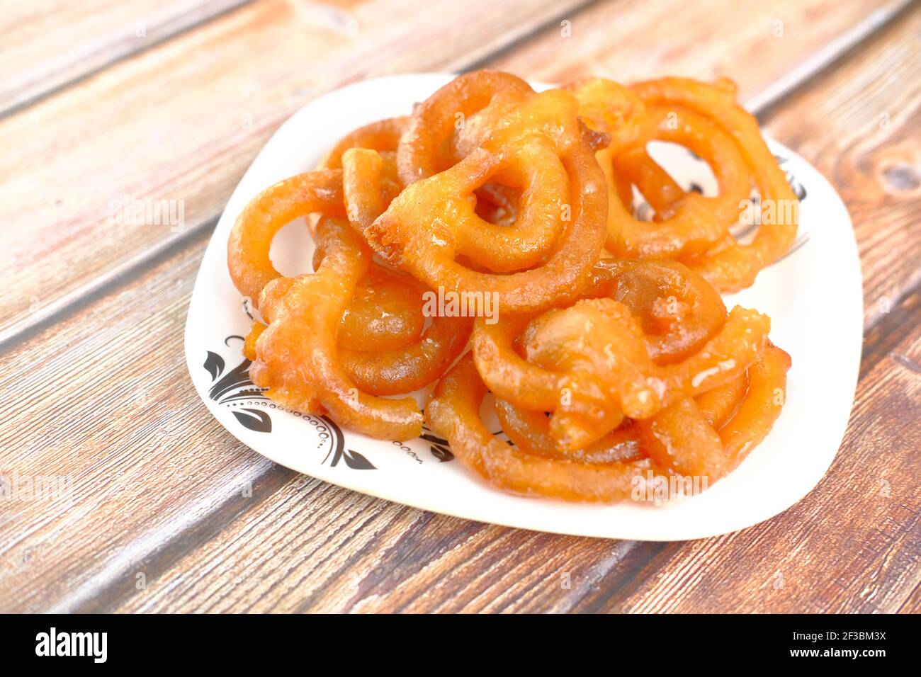 Jalebi indian sweet food on a plate Stock Photo - Alamy