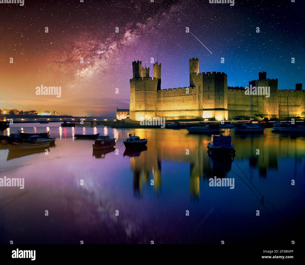 GB - WALES: Caernarfon Castle by night Stock Photo - Alamy
