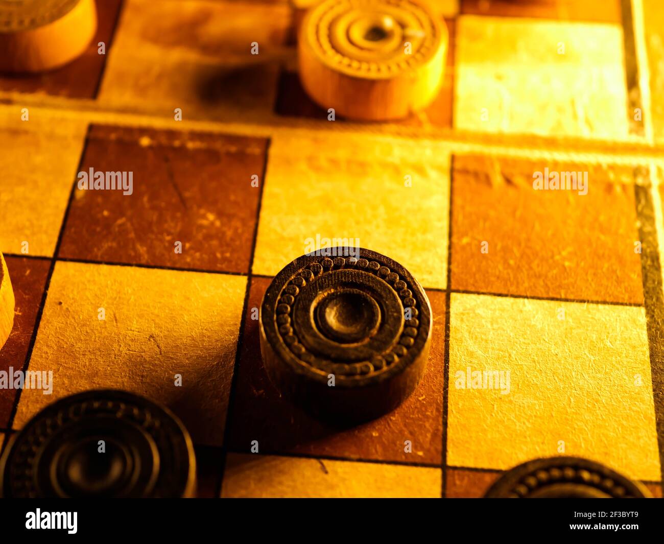 Vintage wooden checkerboard with brown and cream colored checkers Stock ...