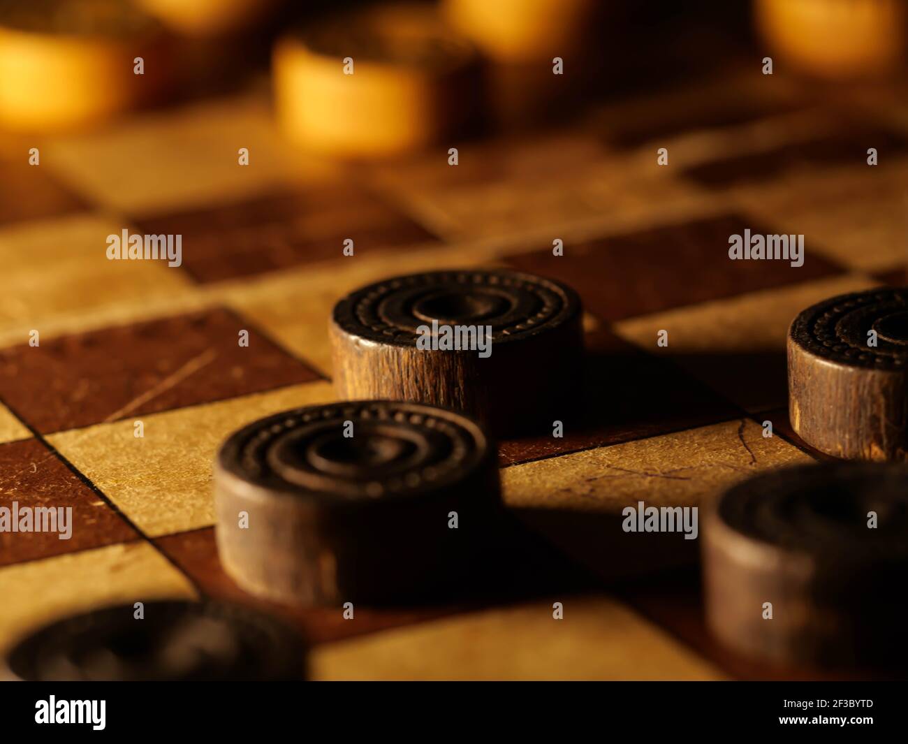 Vintage wooden checkerboard with brown and cream colored checkers Stock ...