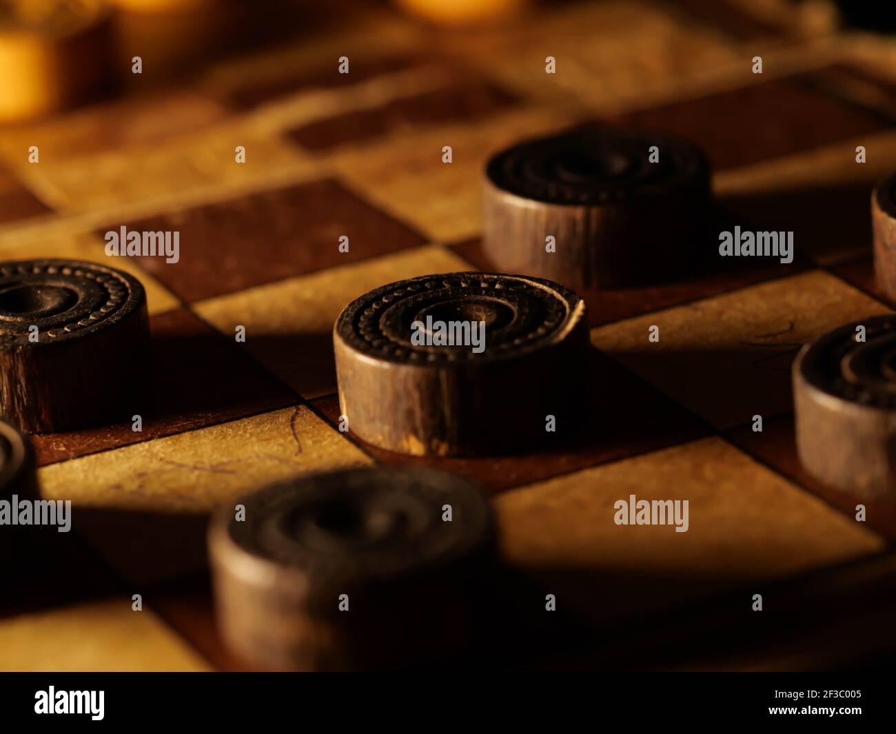 Vintage wooden checkerboard with brown and cream colored checkers Stock ...