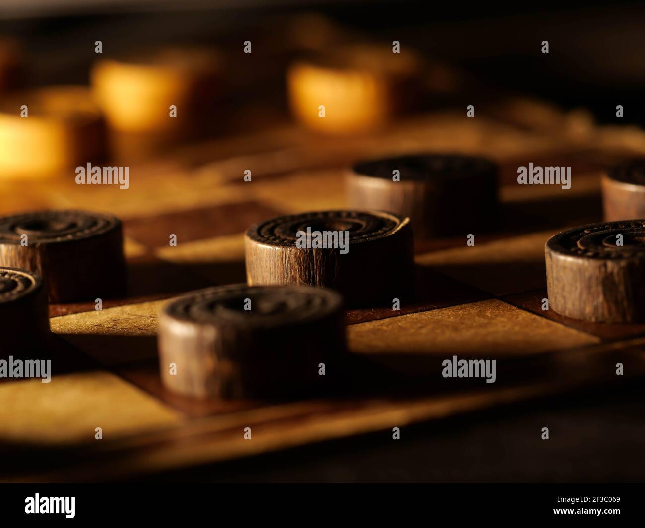 Vintage wooden checkerboard with brown and cream colored checkers Stock ...