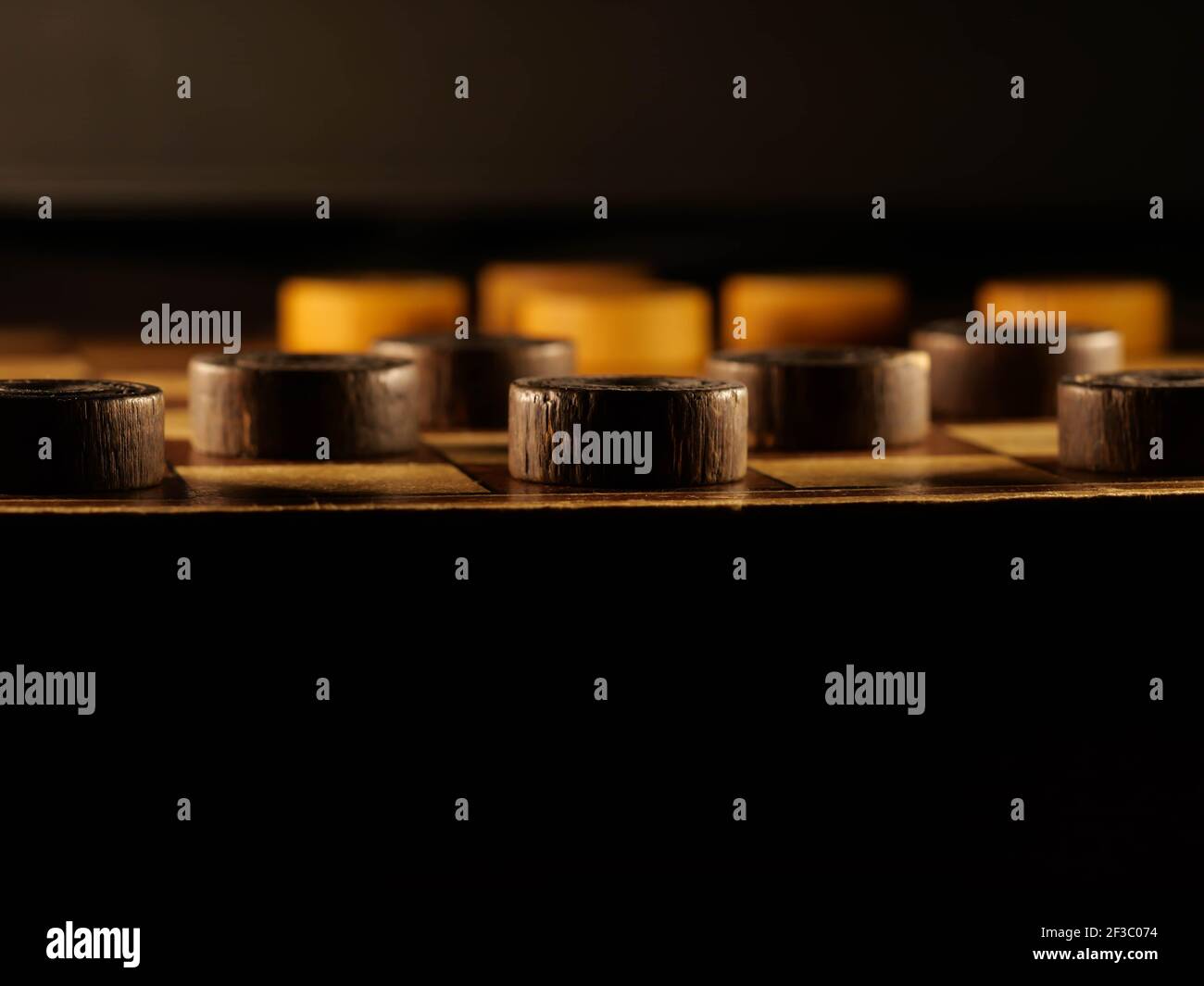 Vintage wooden checkerboard with brown and cream colored checkers Stock ...