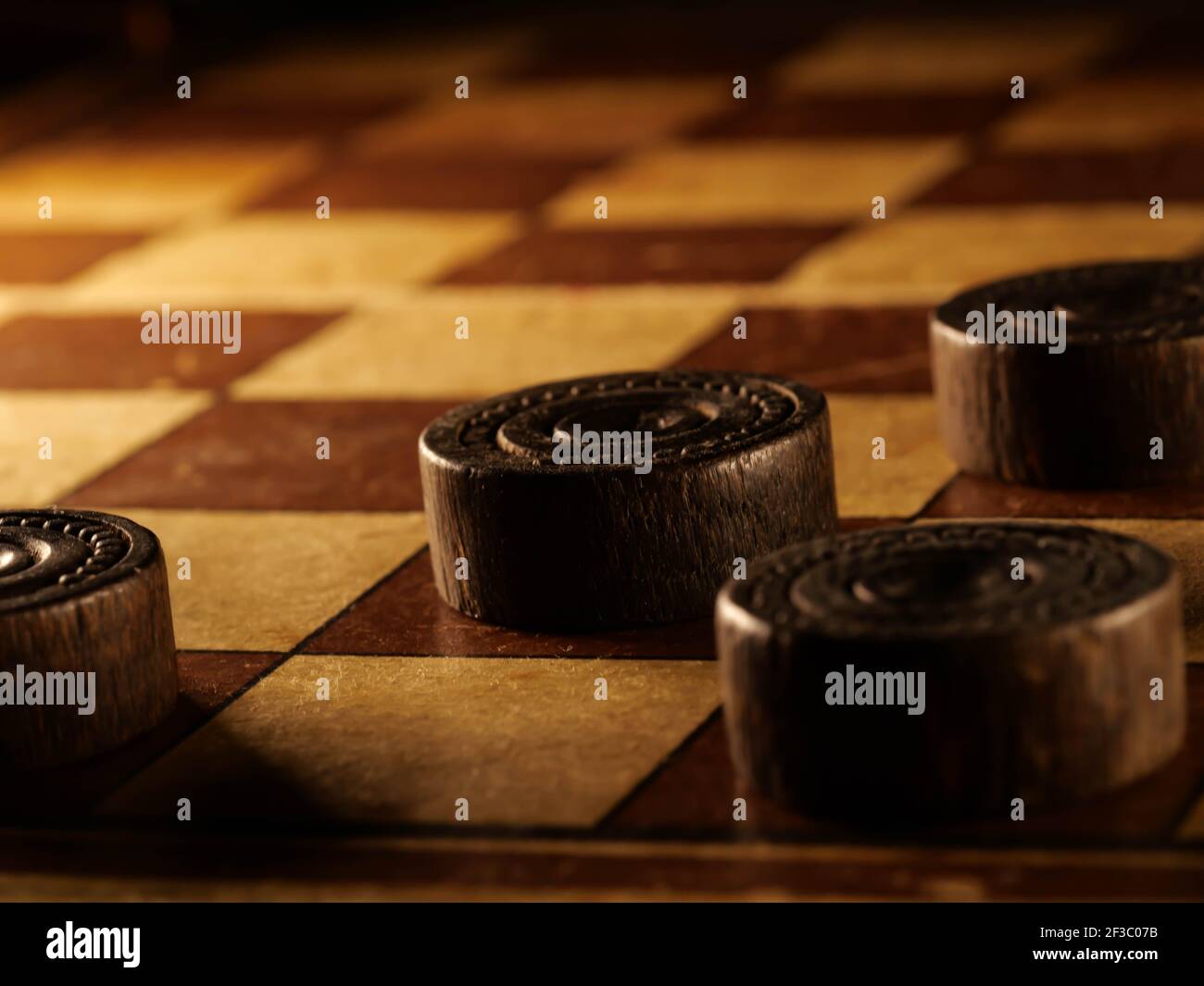 Vintage wooden checkerboard with brown and cream colored checkers Stock ...