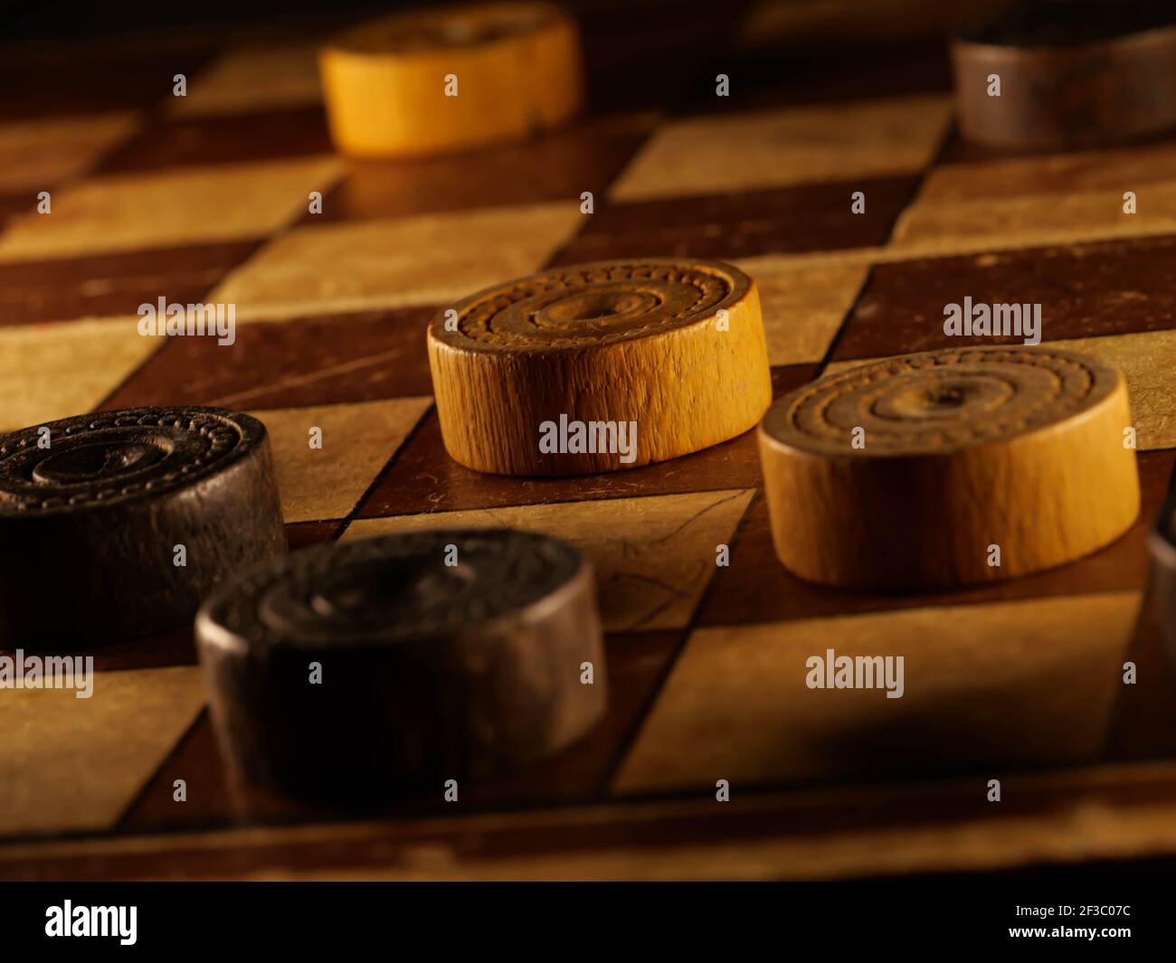 Vintage wooden checkerboard with brown and cream colored checkers Stock ...