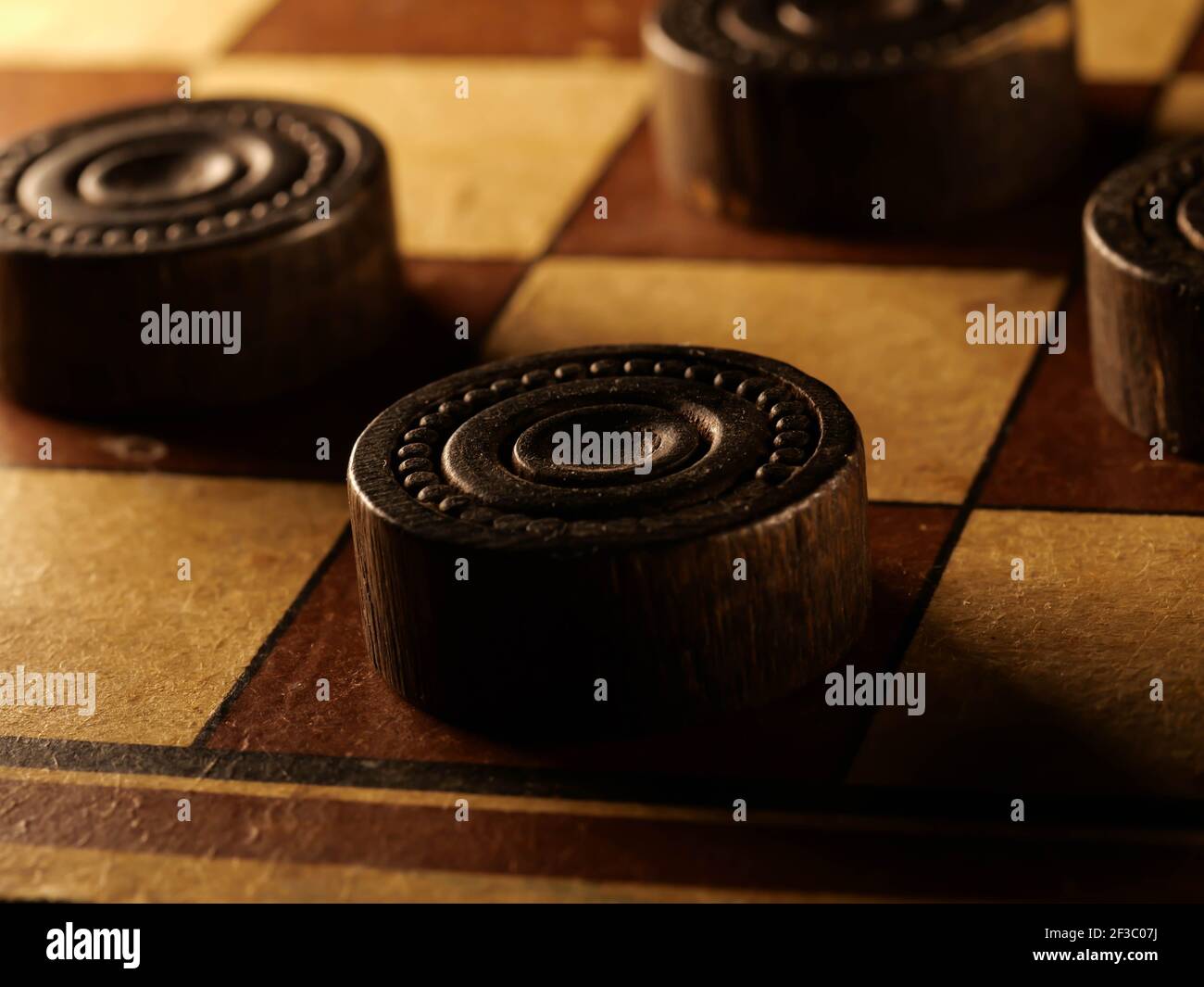 Vintage wooden checkerboard with brown and cream colored checkers Stock ...