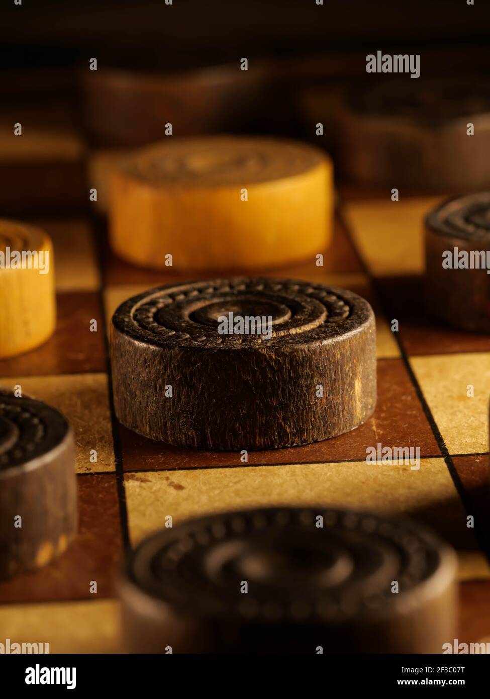 Vintage wooden checkerboard with brown and cream colored checkers Stock ...