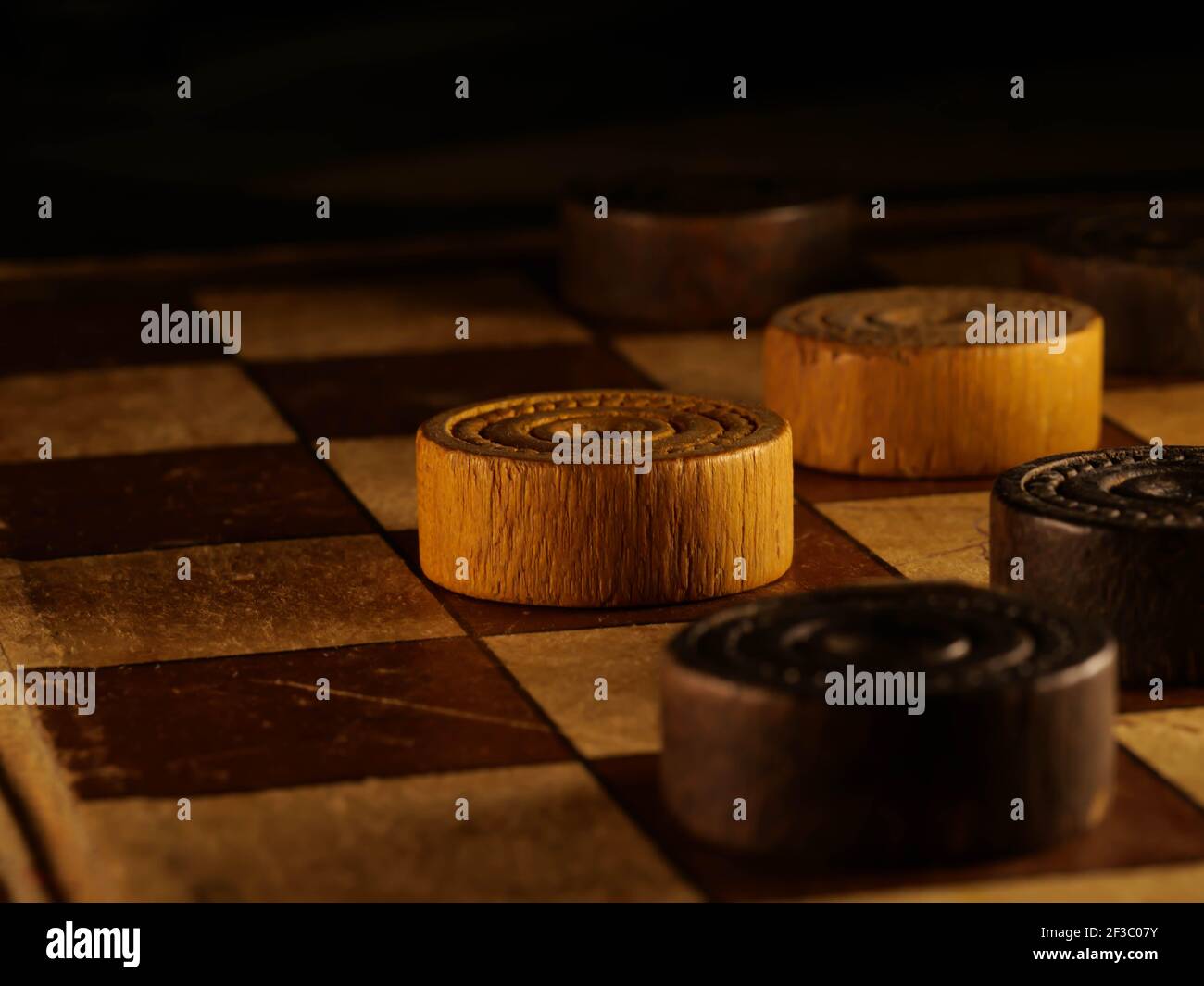 Vintage wooden checkerboard with brown and cream colored checkers Stock ...