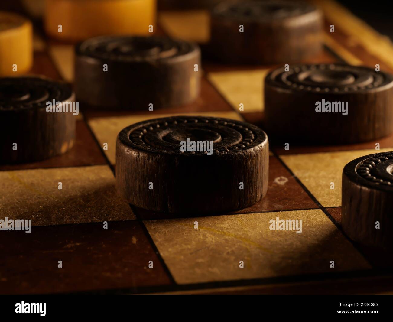 Vintage wooden checkerboard with brown and cream colored checkers Stock ...