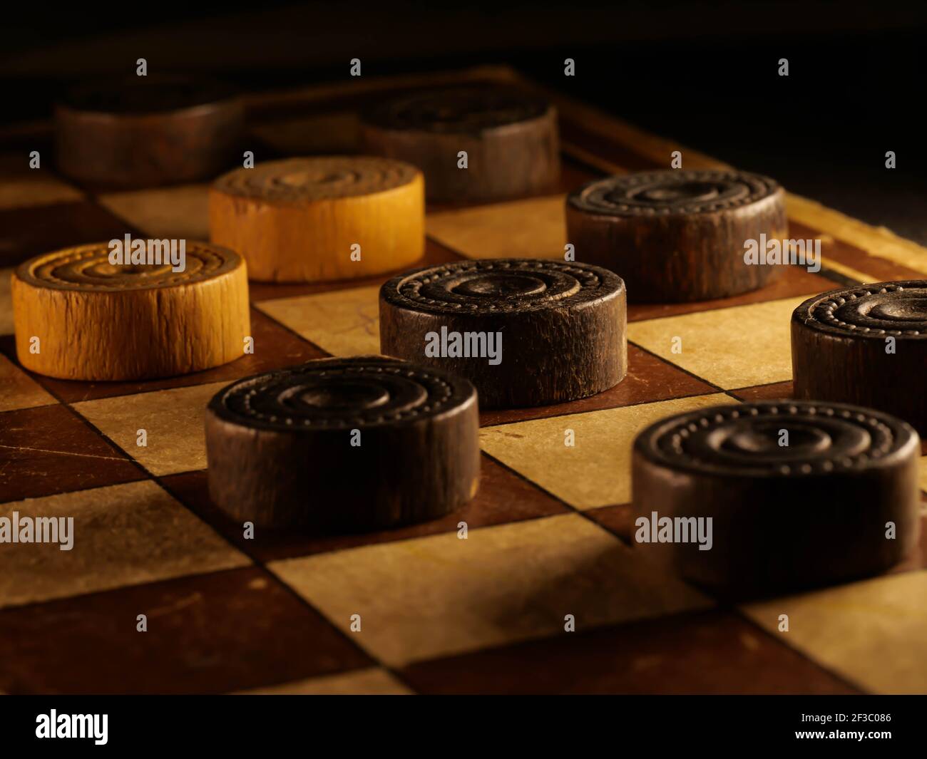 Vintage wooden checkerboard with brown and cream colored checkers Stock ...