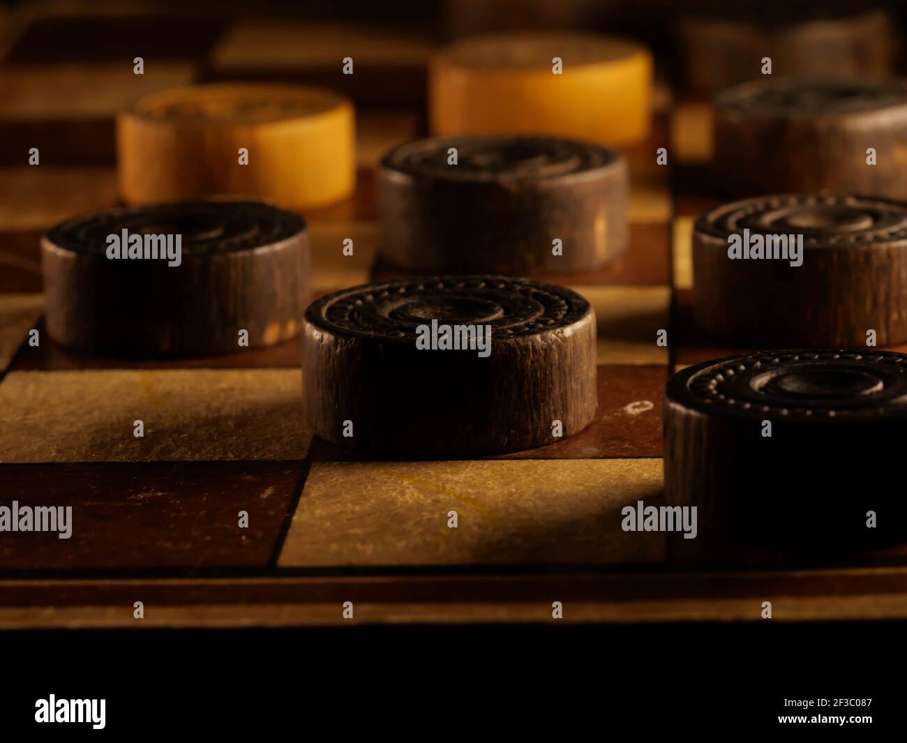 Vintage wooden checkerboard with brown and cream colored checkers Stock ...