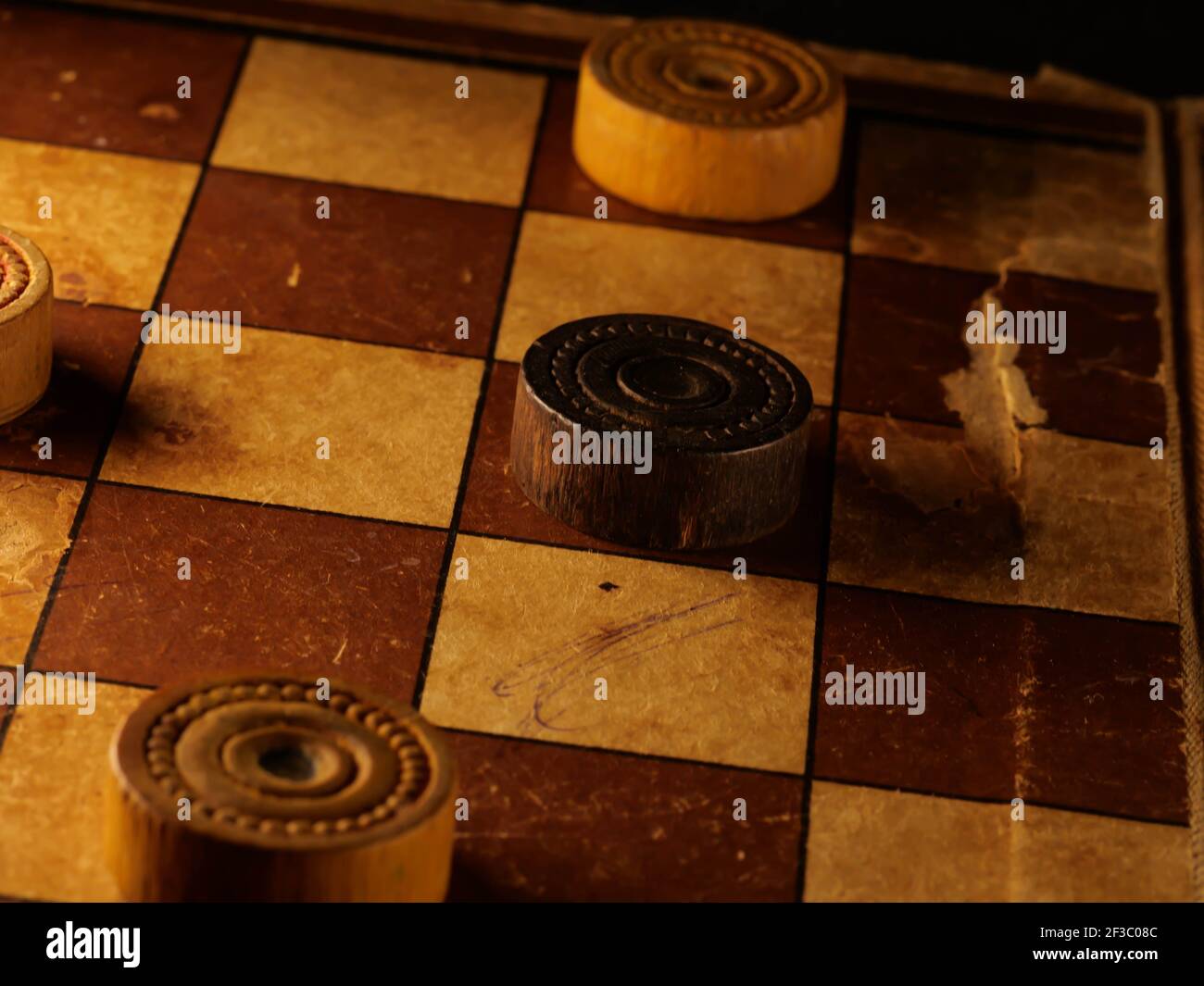Vintage wooden checkerboard with brown and cream colored checkers Stock ...