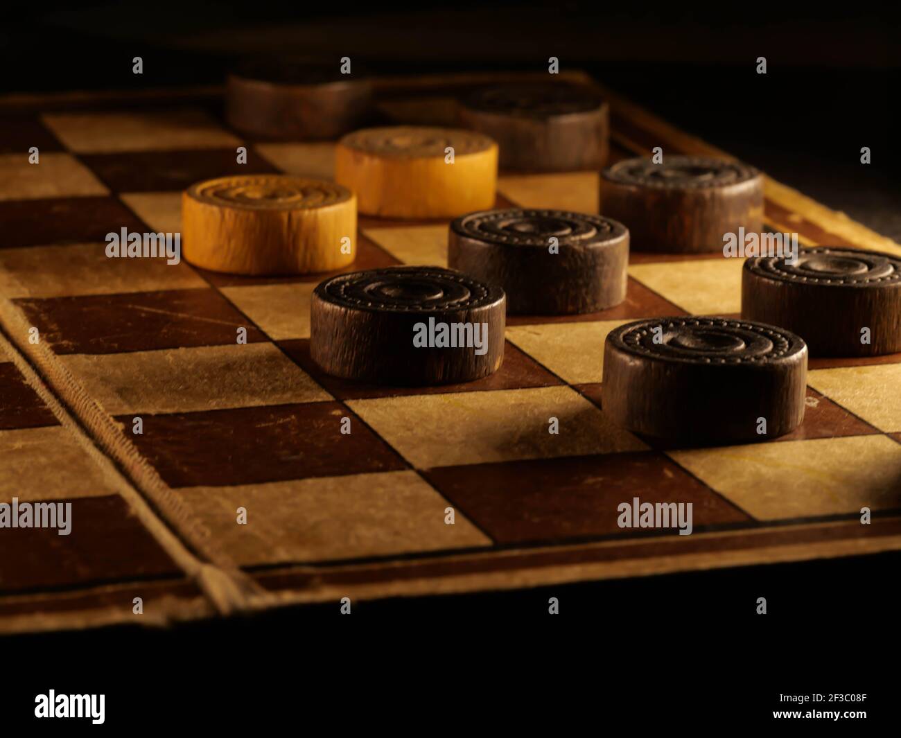 Vintage wooden checkerboard with brown and cream colored checkers Stock ...