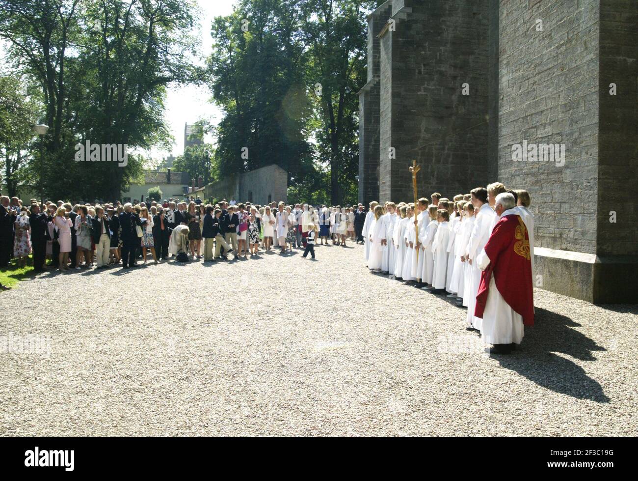 Confirmation, with confirmands and priest, outside Vadstena abbey ...