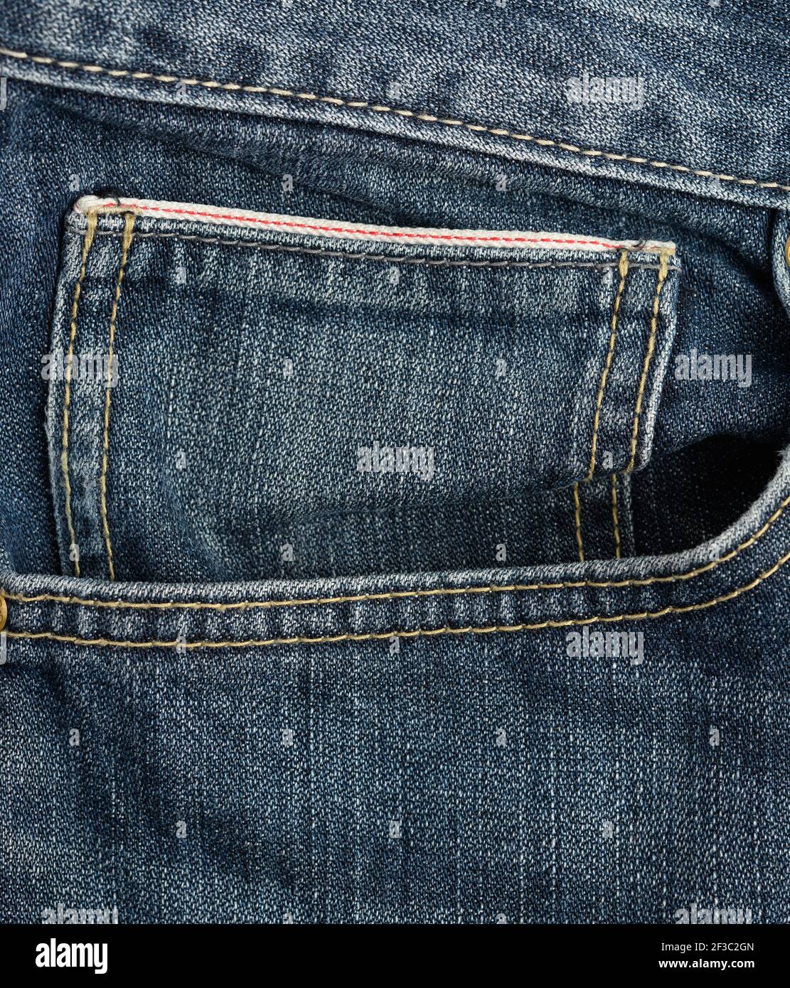 front pocket of blue classic jeans, full frame, close up Stock Photo ...