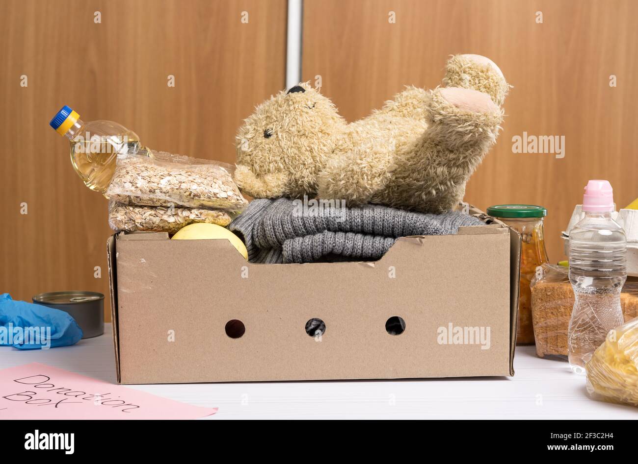 cardboard box with food and things to help those in need, concept of ...