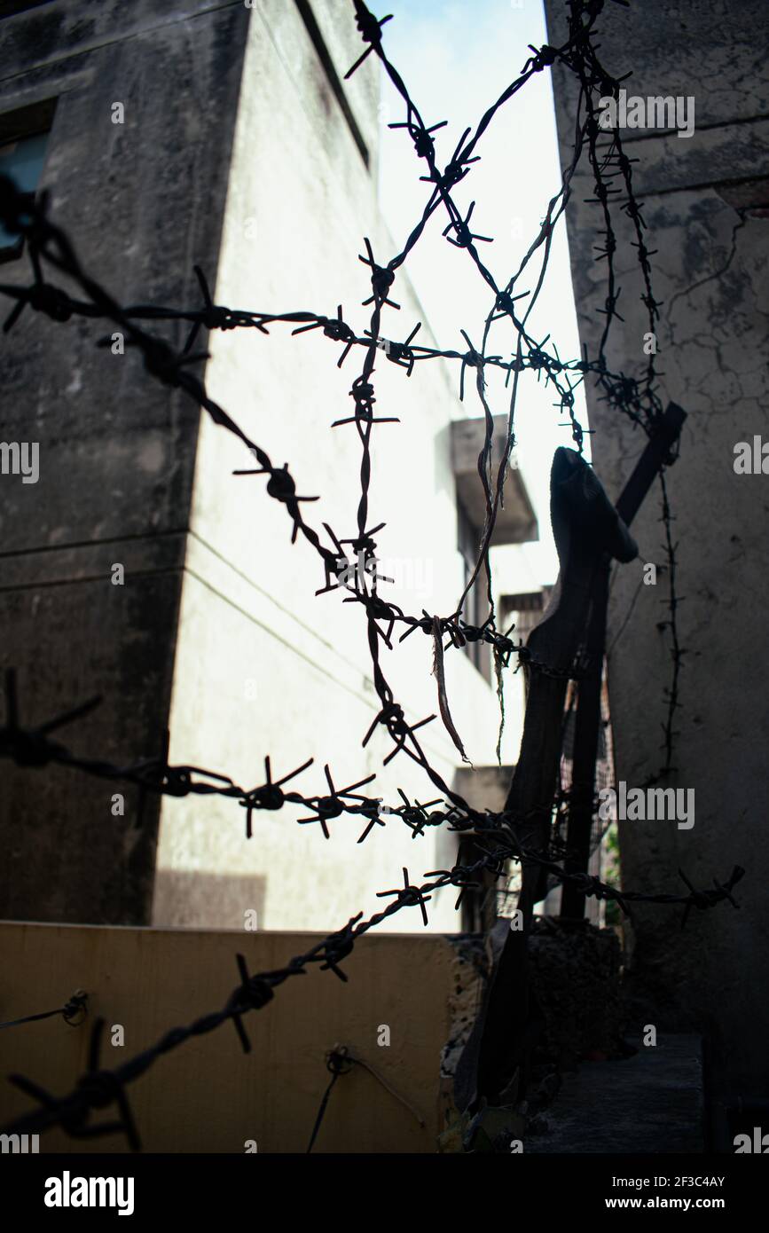 Dramatic contrasty background vintage image of a barbed wire fence ...