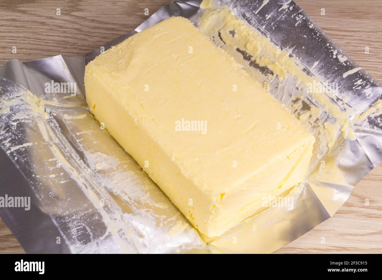 Pack of salted butter with unwrapped paper Stock Photo - Alamy