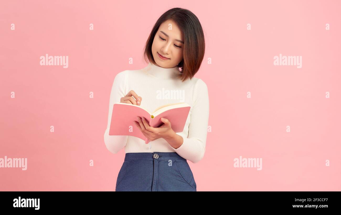 Photo of pretty lady hold book planner first writing notes isolated on ...