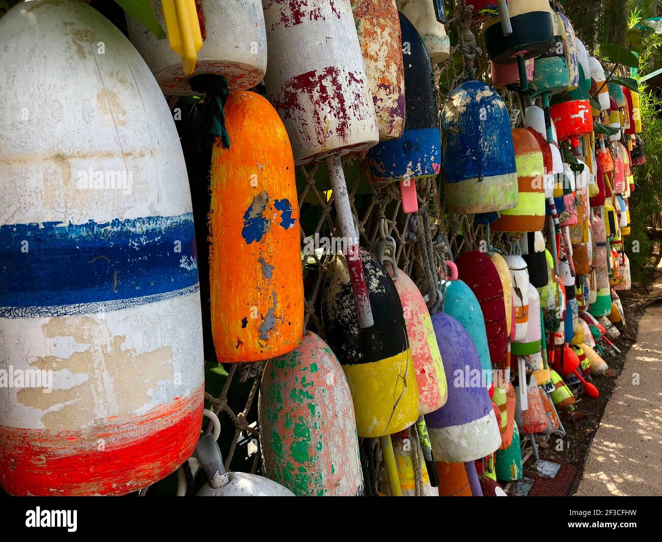 The colorful old wooden fishing buoys Stock Photo - Alamy