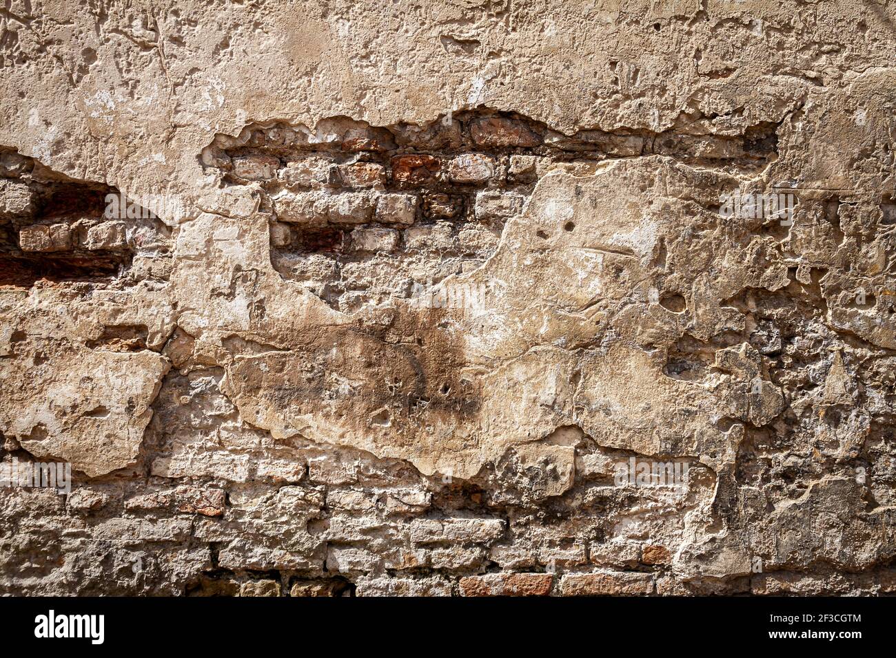 Old brick and plaster wall texture background. Painted distressed wall ...