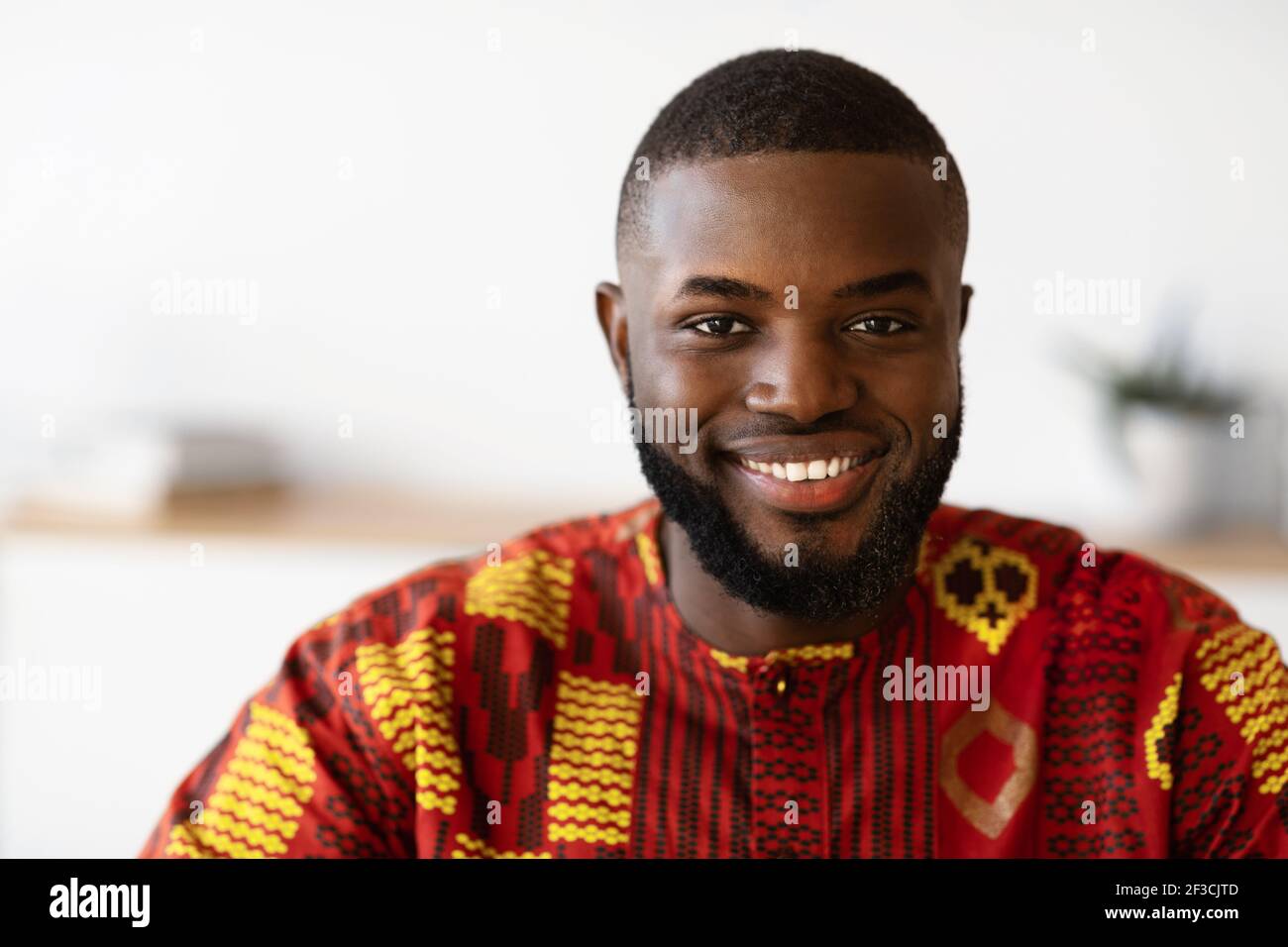 Closeup portrait of handsome positive black man in traditional african ...