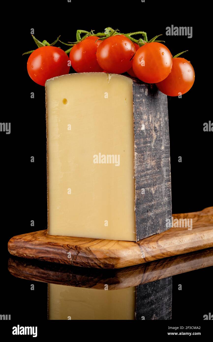 Delicious traditional Swiss melted raclette cheese with vegetables ...