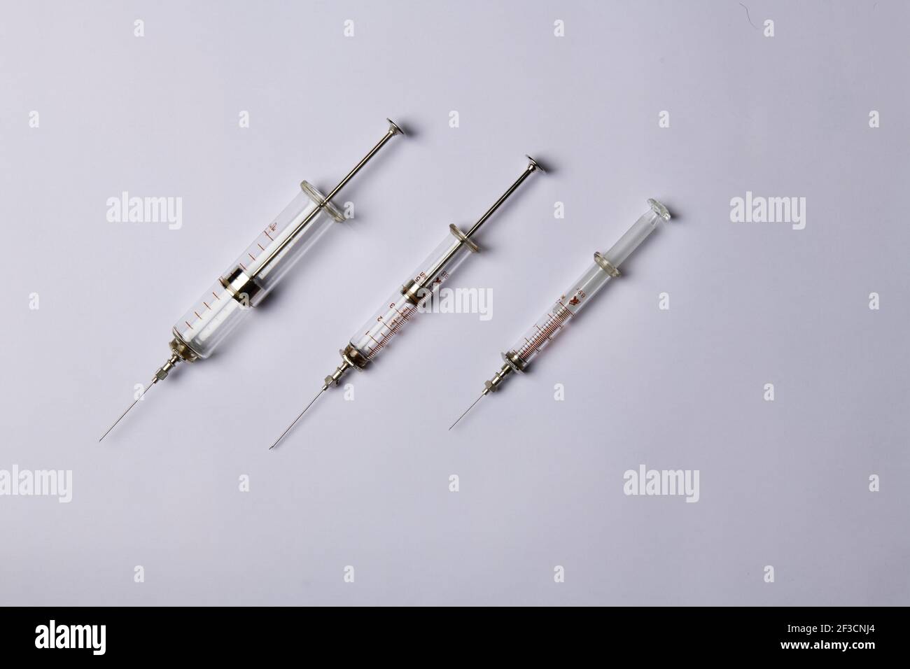 medical syringes of different lengths on a white background Stock Photo ...