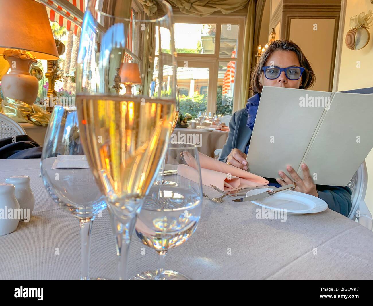 Woman Reading the Menu in Luxury Restaurant in Switzerland Stock Photo ...