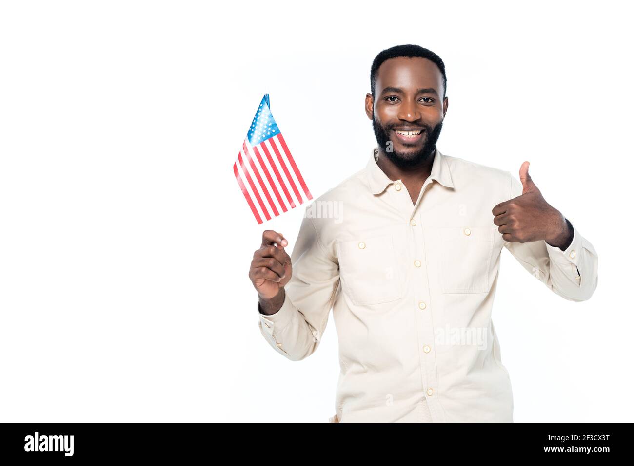 happy american man holding small flag of usa while showing thumb up ...